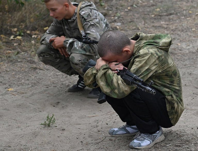 Russian kids learn to throw grenades, carry rifles in training to be ...