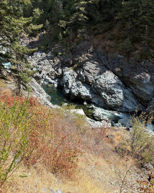 Truck crashes down dangerous Northern California river canyon, lands ...