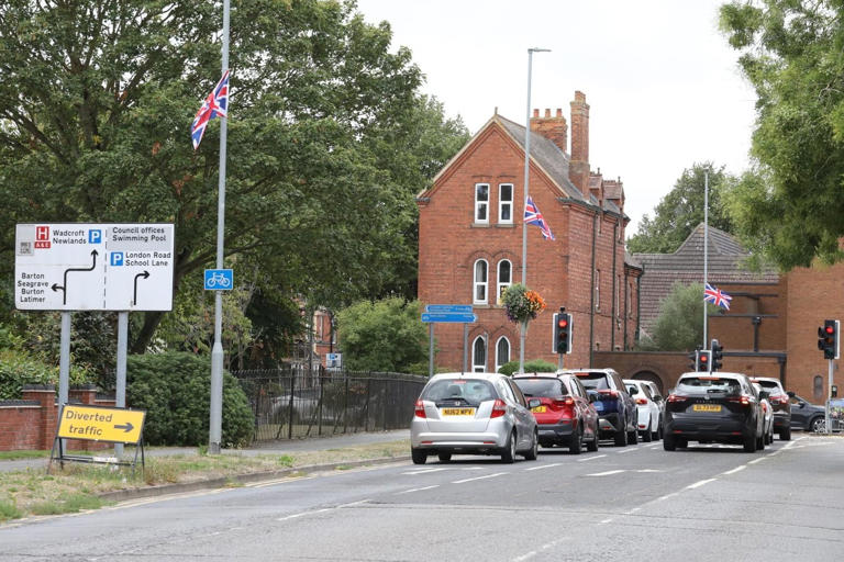 Kettering streets lined with scores of Union and St George flags put up ...