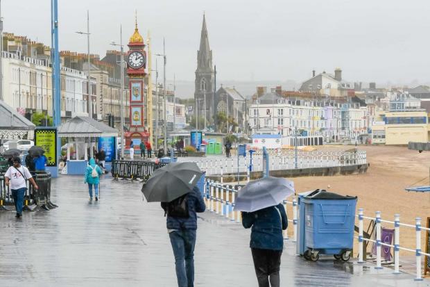Heavy rain warning with risk of flooding and travel disruption