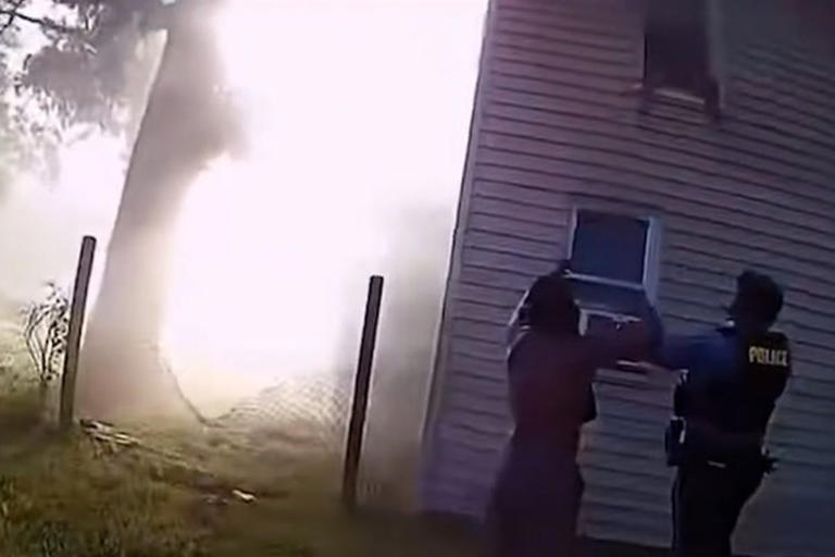 Heart-stopping moment police catch child jumping from window of burning ...