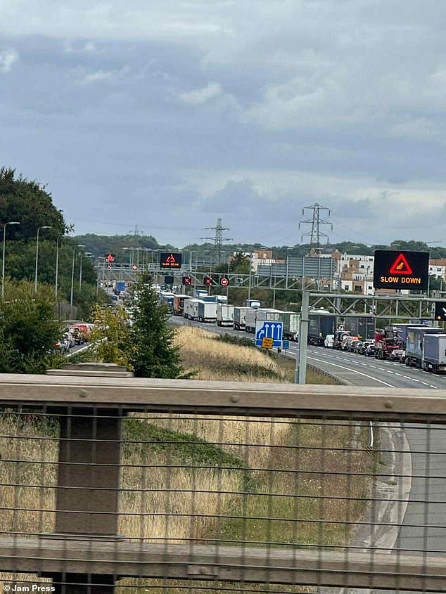 Desperate couple ditch taxi in three mile motorway tailbacks and walk ...