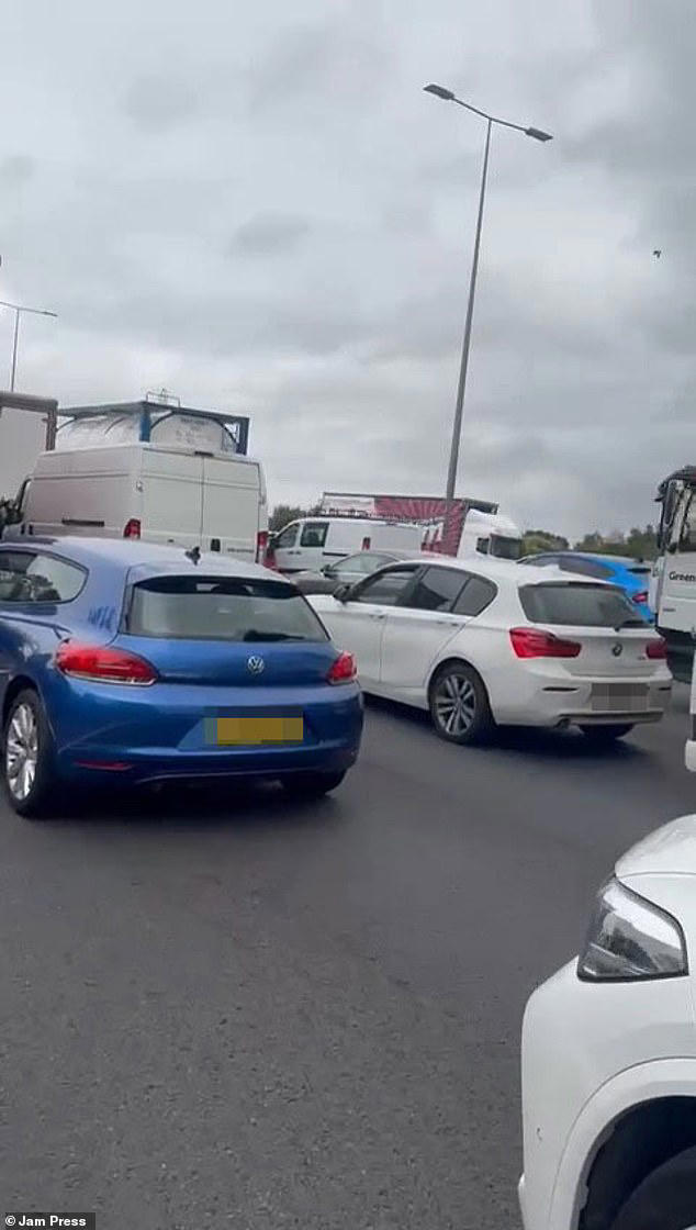 Desperate couple ditch taxi in three mile motorway tailbacks and walk ...