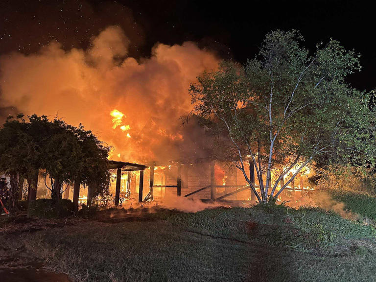 Crews battle massive two-story house fire in Madison Township