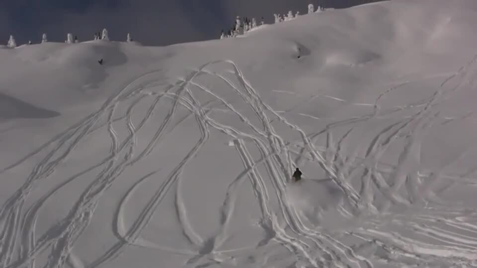 Snowmobile Flips Over on Fallen Rider