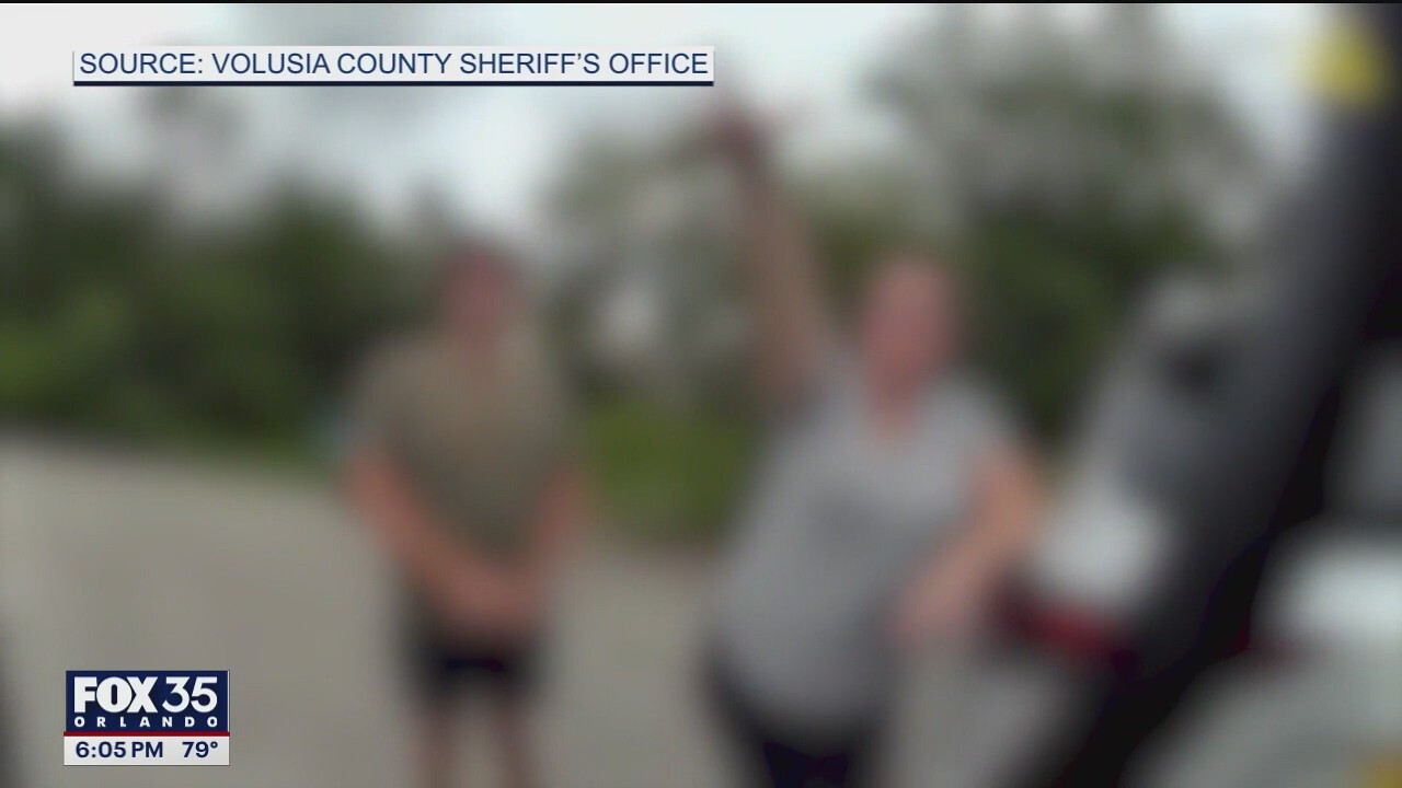 Man accused of pointing gun at kids at bus stop