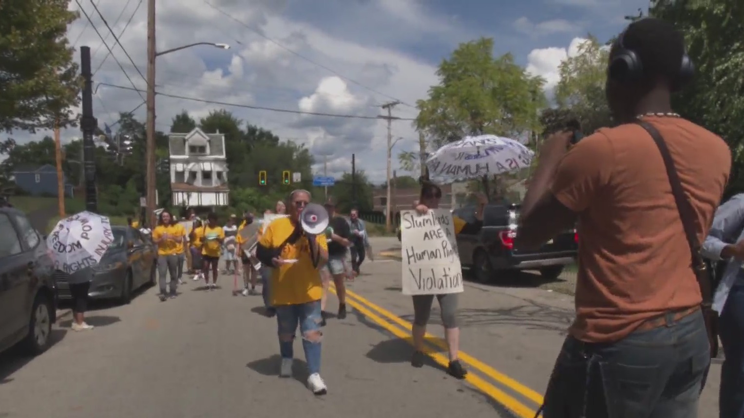 Mon View Heights residents march to managers, demanding answers