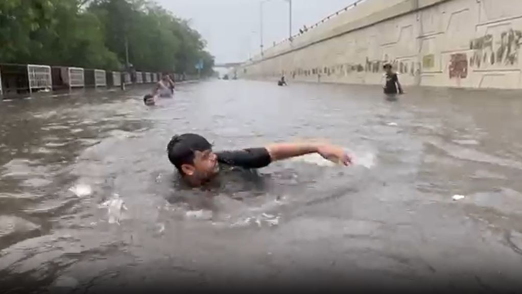 Watch: Delhi road turns into open-air pool as people swim on inundated stretch