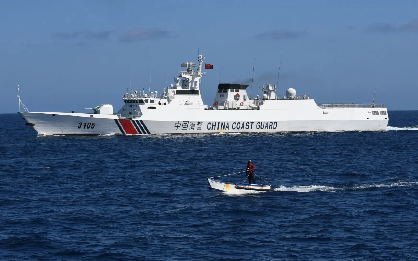 China’s military, coast guard patrol disputed South China Sea atoll