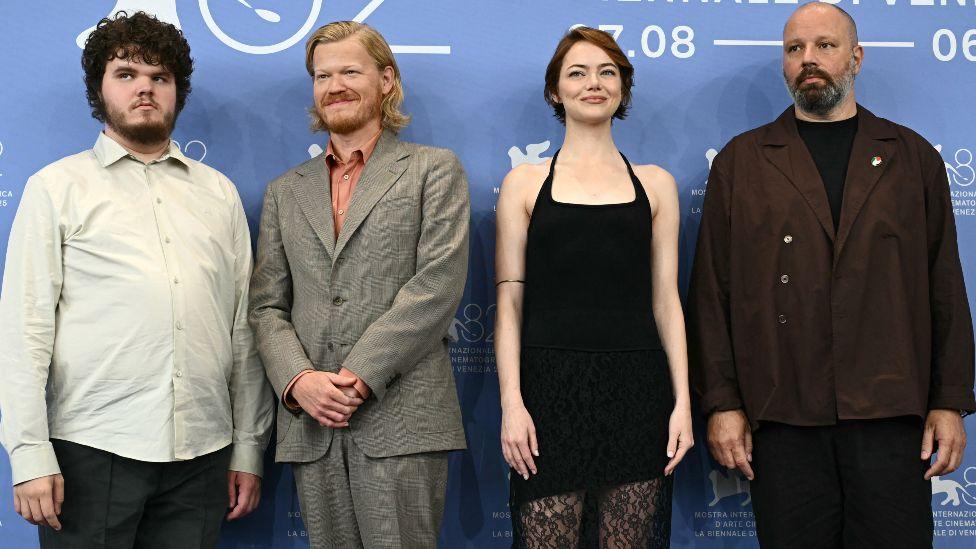 Emma Stone dazzles Venice with alien kidnap drama