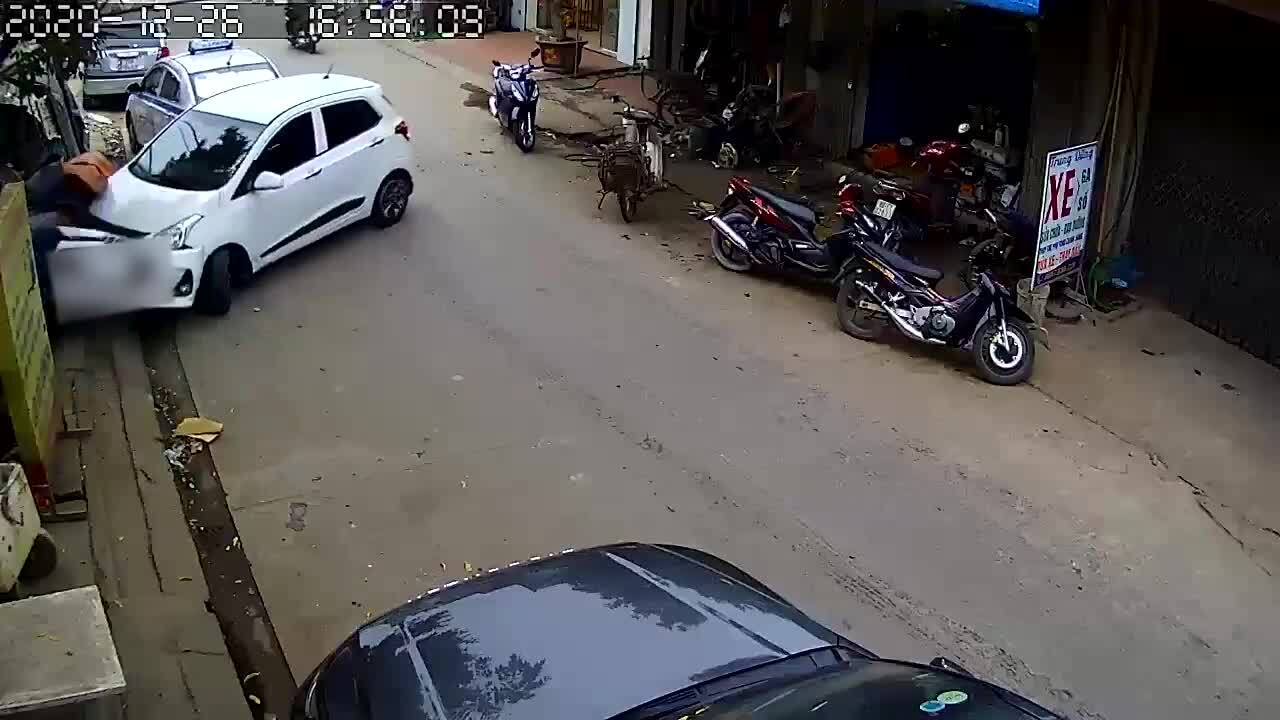Car Reverses over Parked Vehicles
