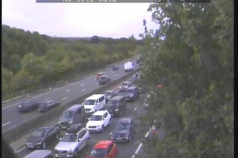 Dozens evacuated from M5 coach fire as drivers face massive delays
