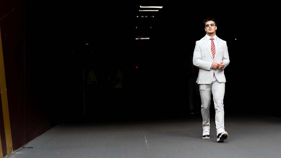 How many positions did Koi Perich play in Minnesota's season opener?