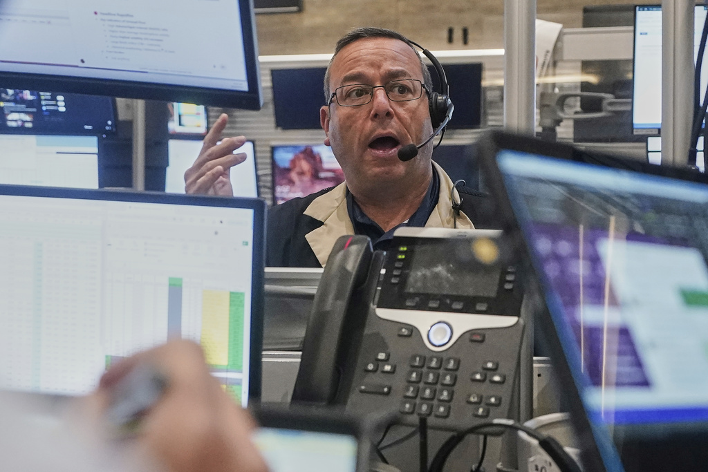 Stocks edge back from their latest all-time highs on Wall Street