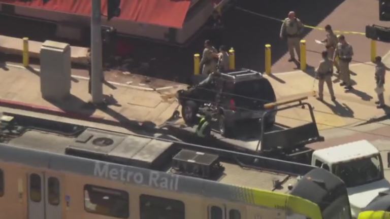 Driver collides with train, slams into sign outside King Taco in East ...