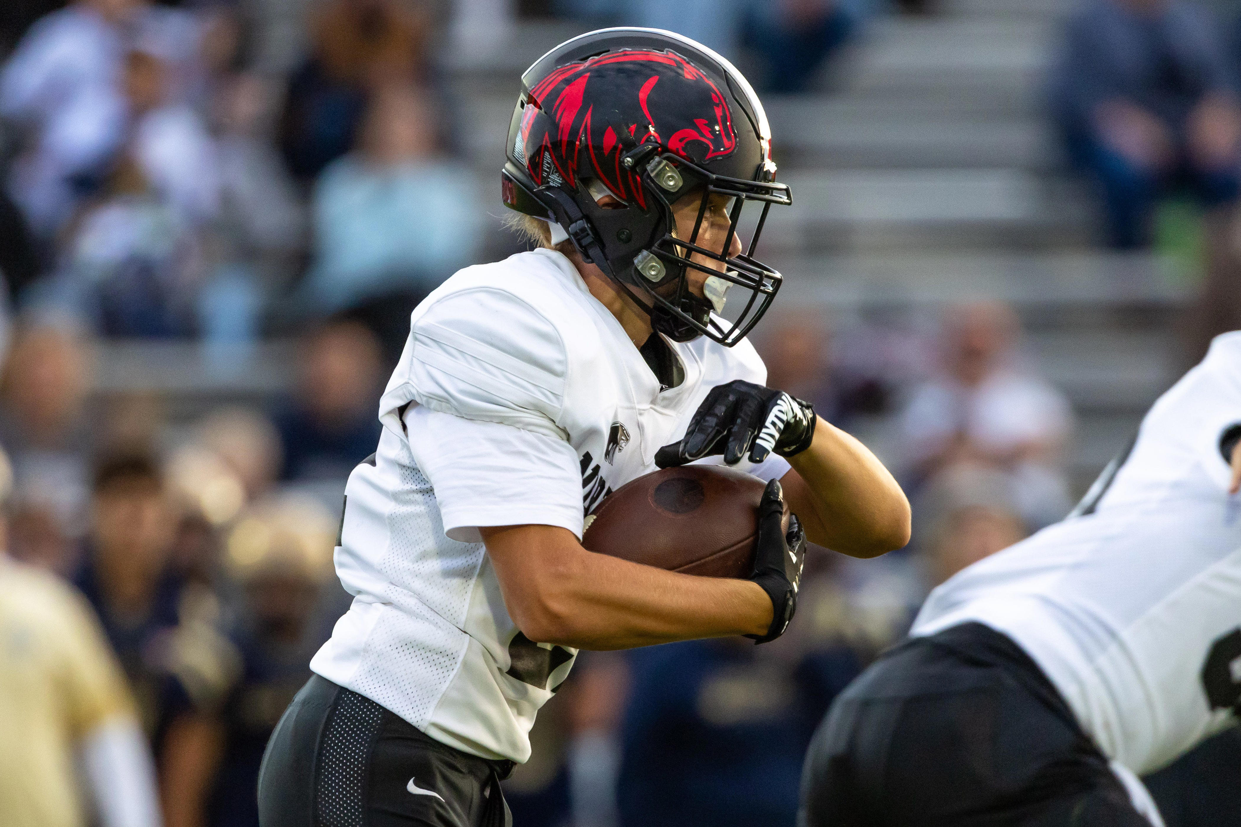 NorthWood, led by Brady Weaver and Austin King, run past New Prairie