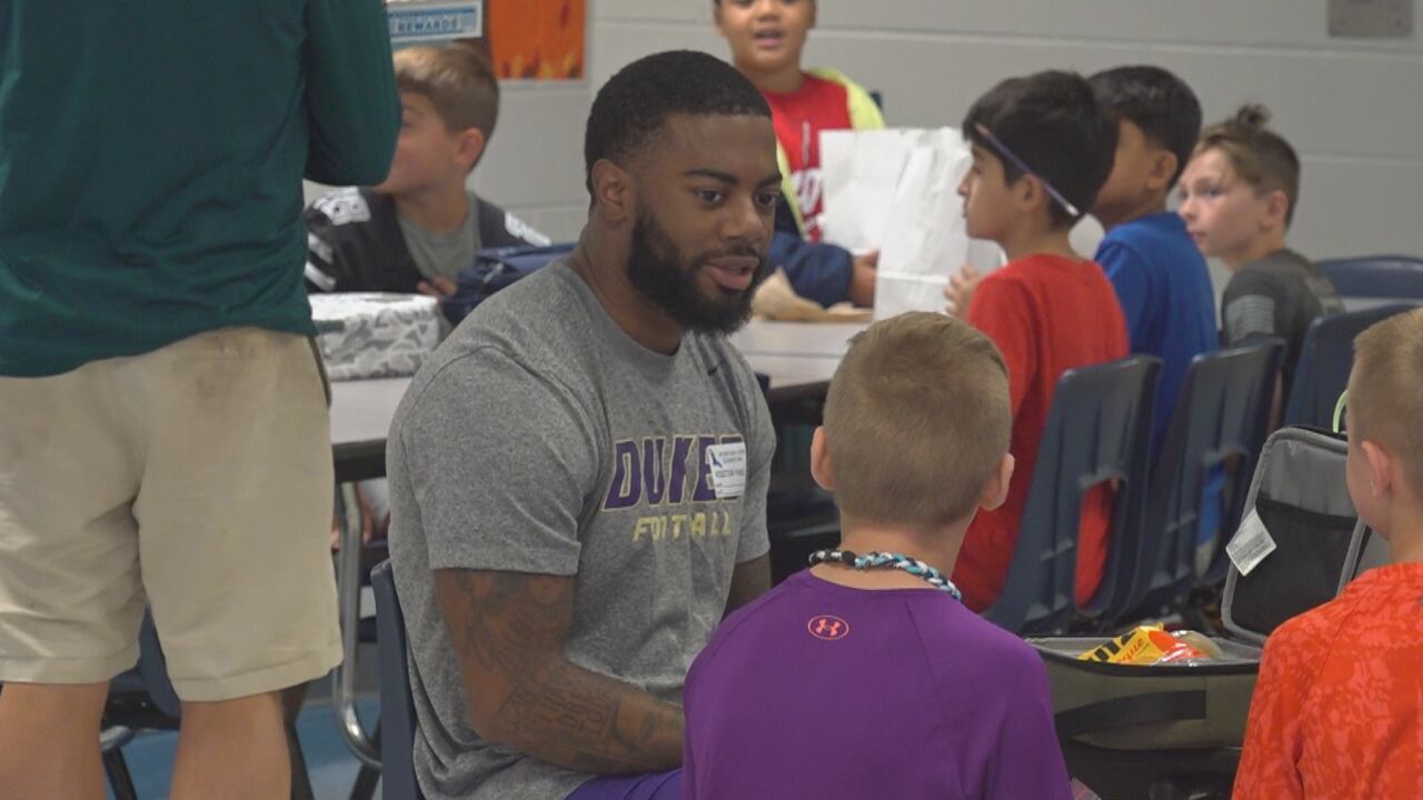 JMU football team kicks off season with visits to Rockingham County schools