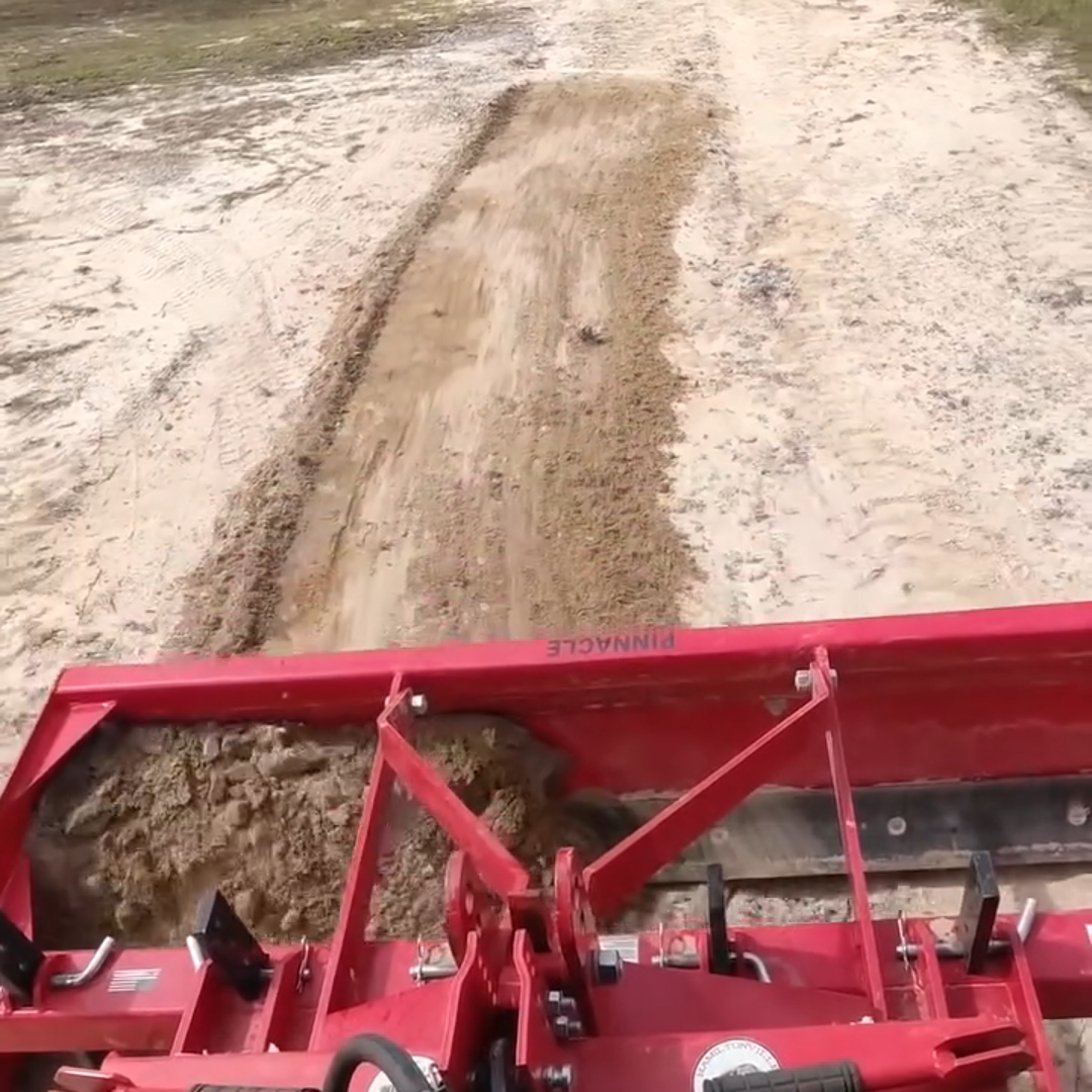 Using a box blade to fix our driveway flooding problem