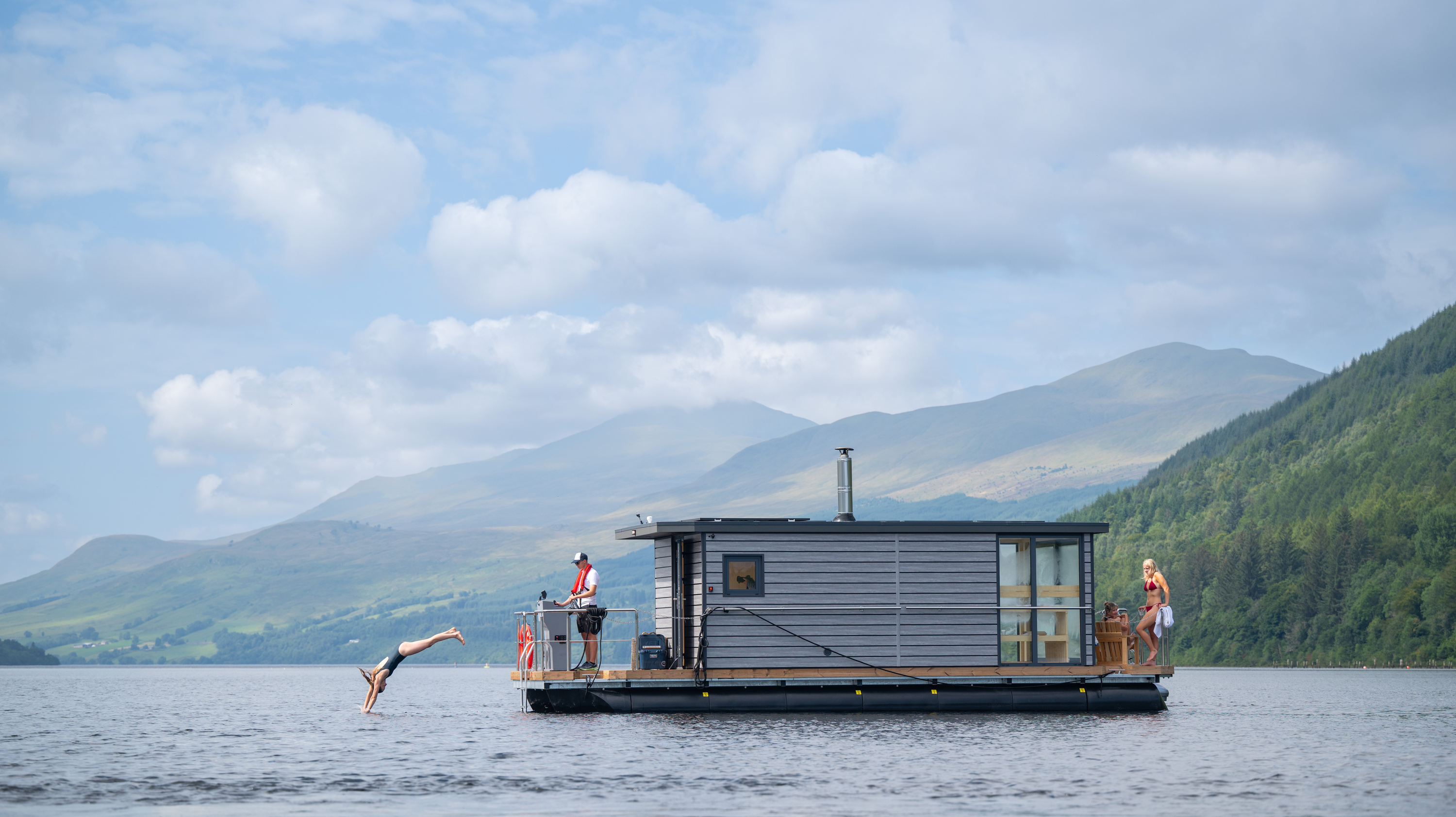 Jumping off the country's first sauna boat into a beautiful Highland ...