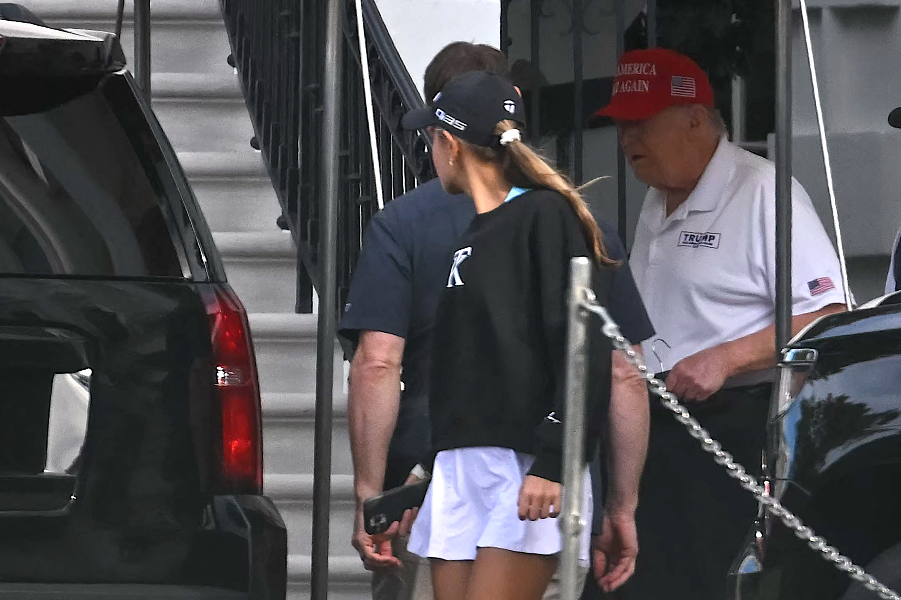 Trump pictured heading to play golf after baseless viral death speculation