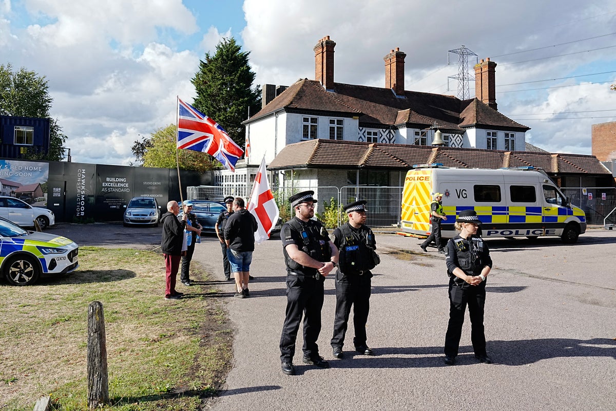 Two men charged after police officers injured at Epping asylum hotel ...
