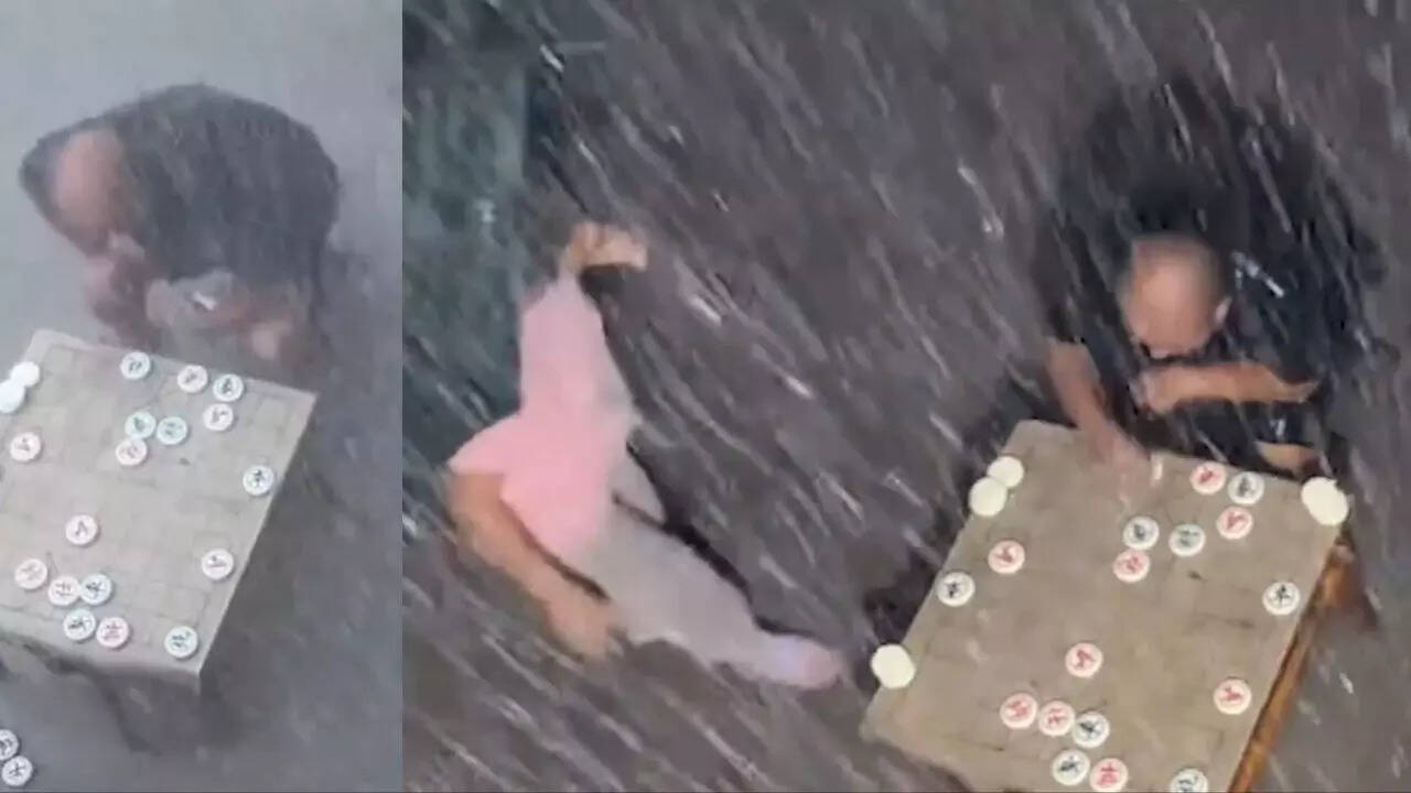 Viral video: Chinese chess player spends 4 hours in heavy rain after ...