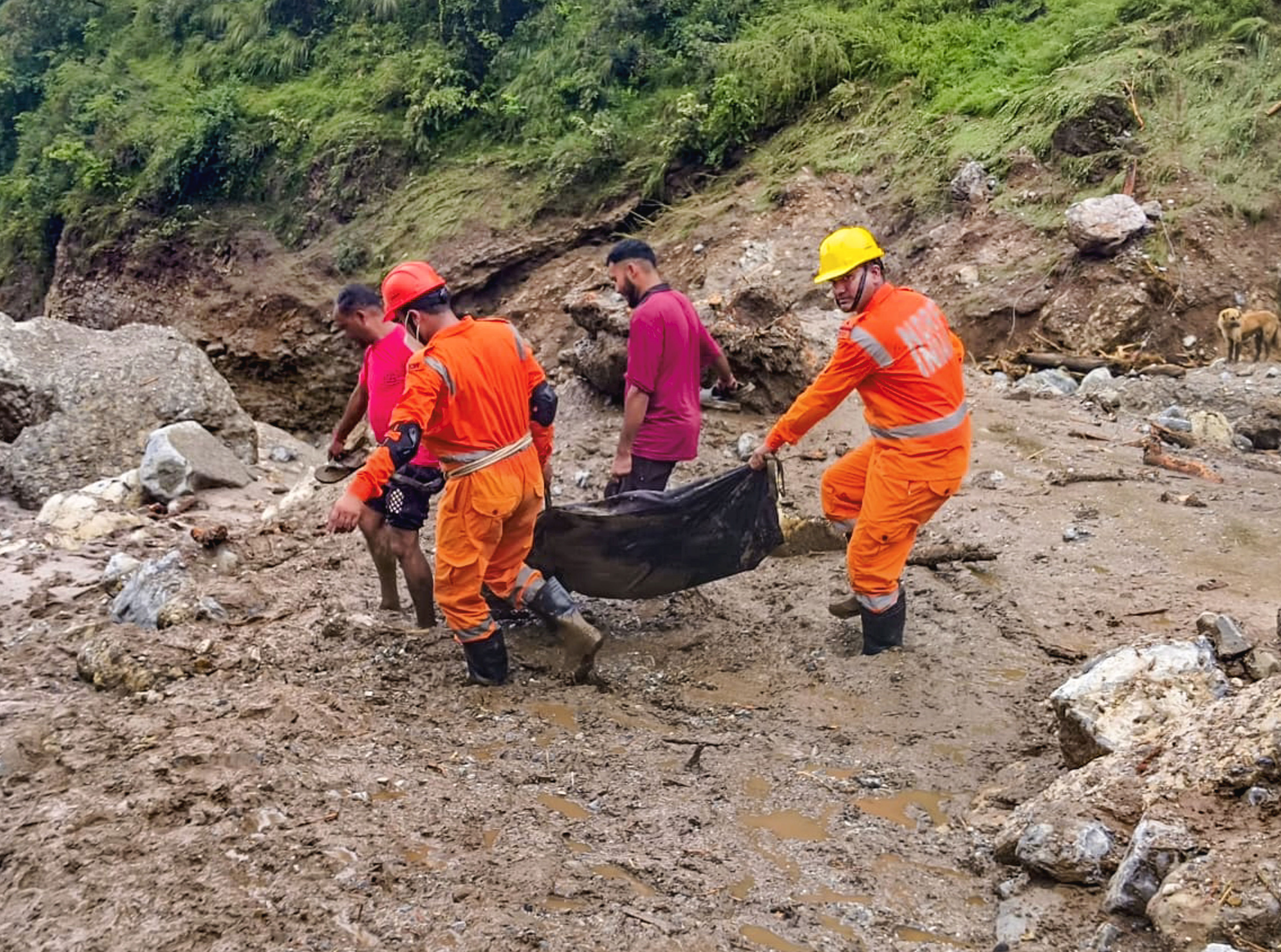 Rescuers sift through debris in search of missing people after rain ...