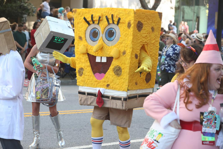 Dragon Con parade filled with colorful costumes in downtown Atlanta