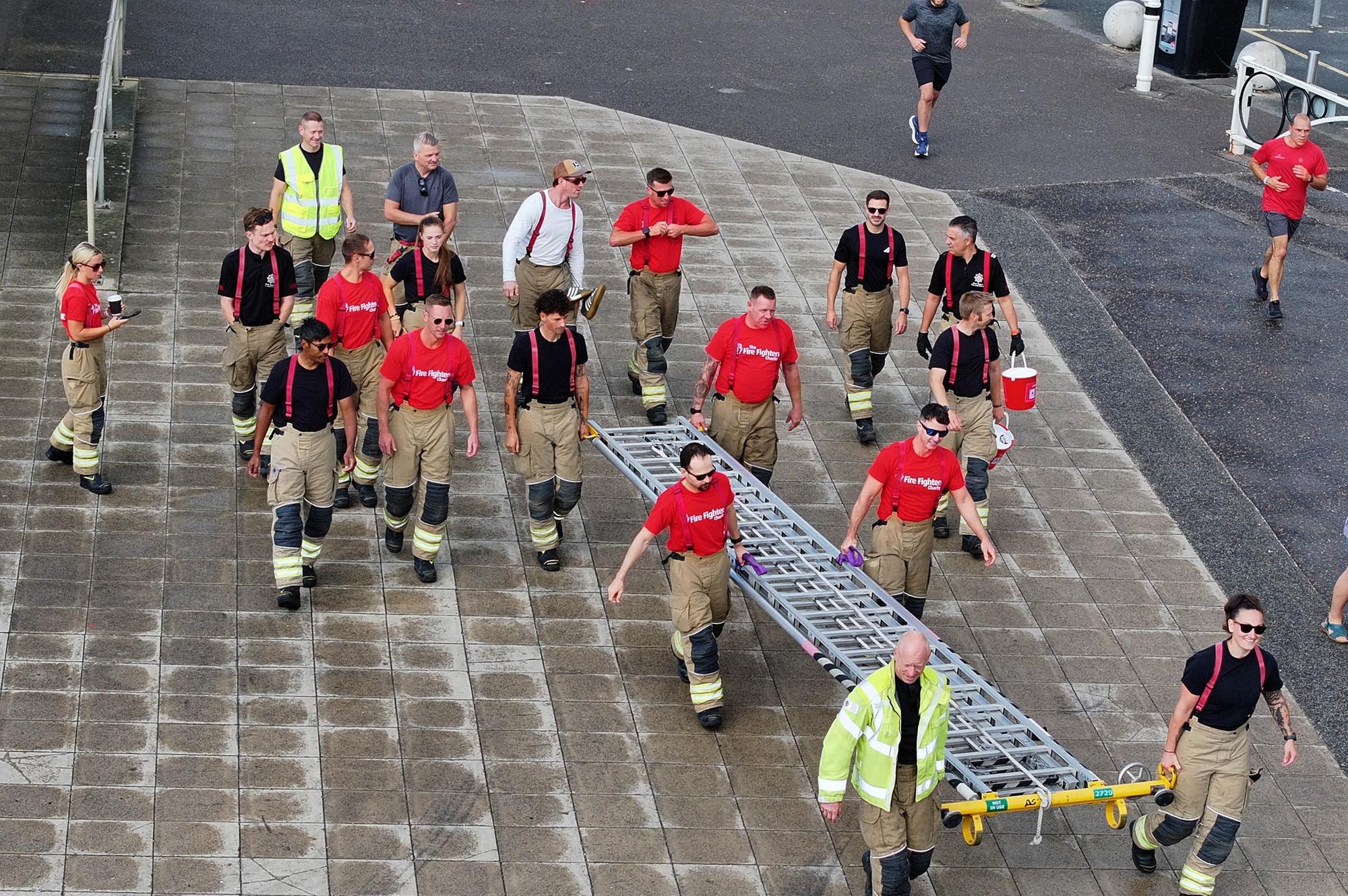 Sussex Firefighters ladder carry from Worthing Pier to Brighton Pier ...