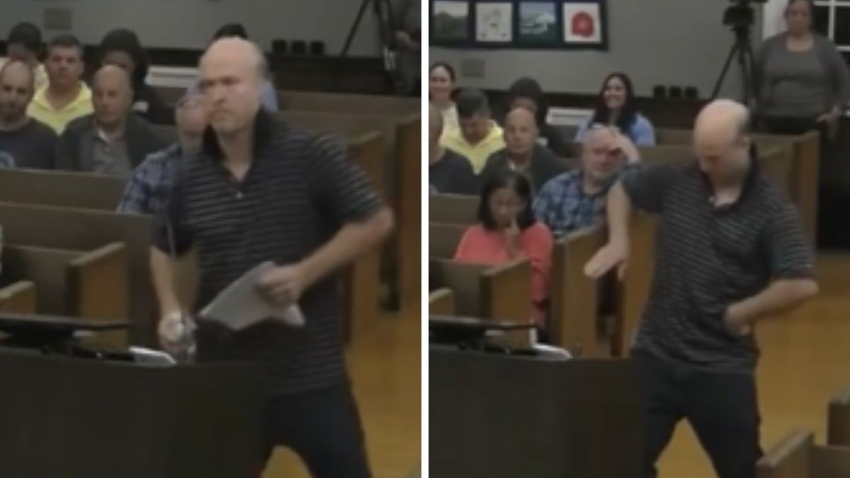 US man dances during town hall meeting as a sign of protest. Video goes ...