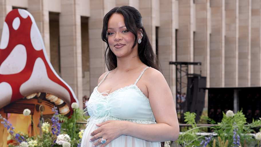 Rihanna Channels Playful ’90s Style With Casual Baby Bump-Baring Look
