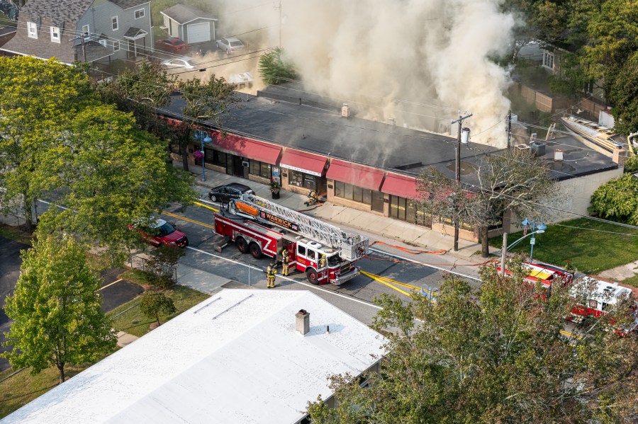 Crews battle fire at Warwick commercial building