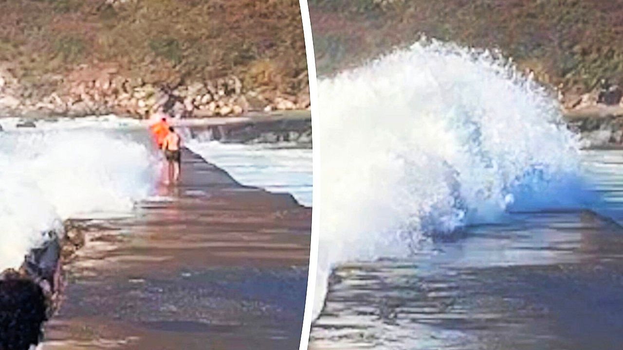 Tourists swept off walkway by giant waves in Spain