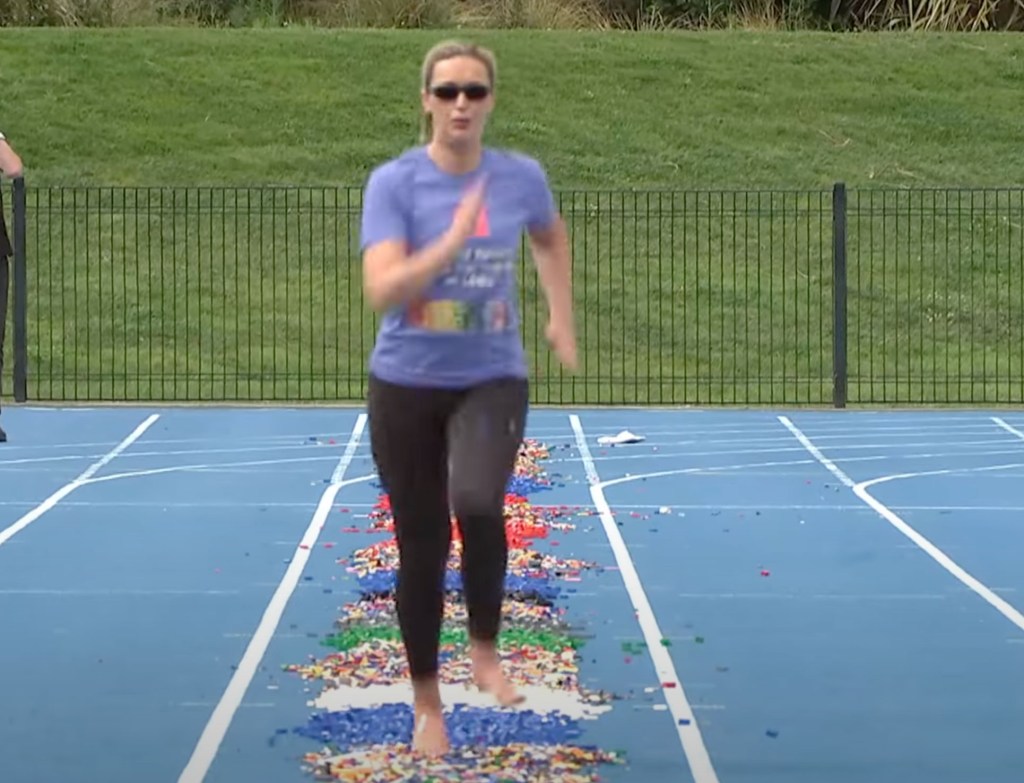 Mom goes viral for earning world record running across a track of LEGOs ...