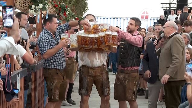 German man fails to break world record by carrying 31 beer mugs at once