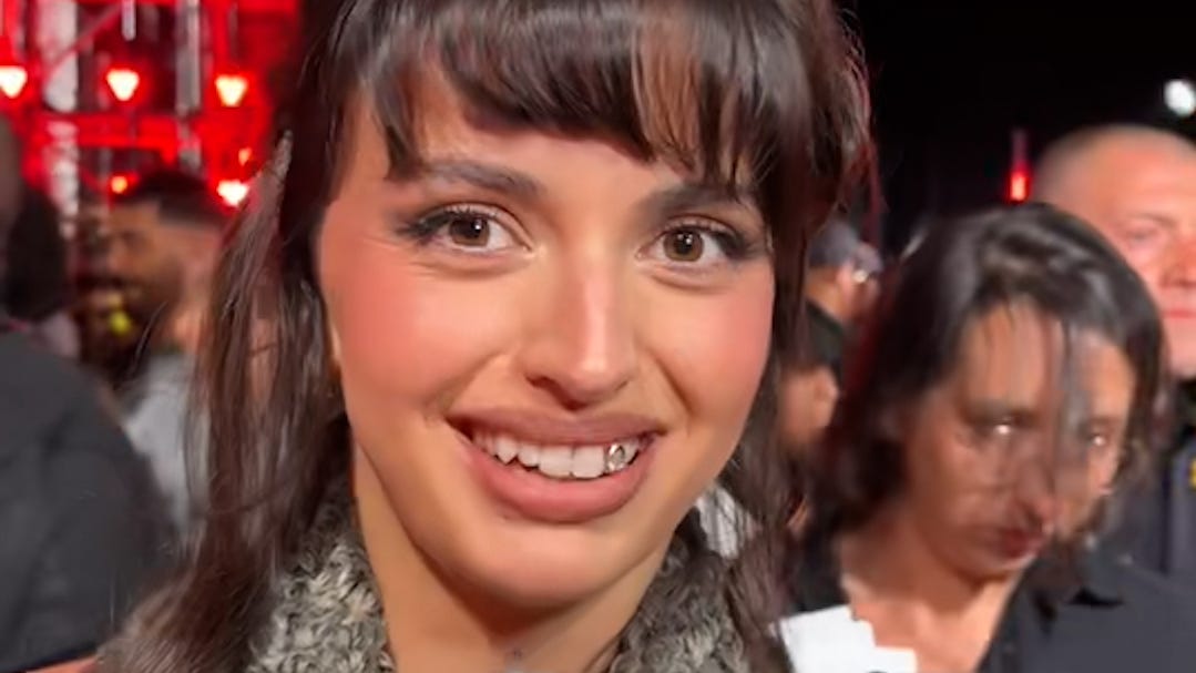 Rebecca Black talks tour with Katy Perry as she stuns at VMAs