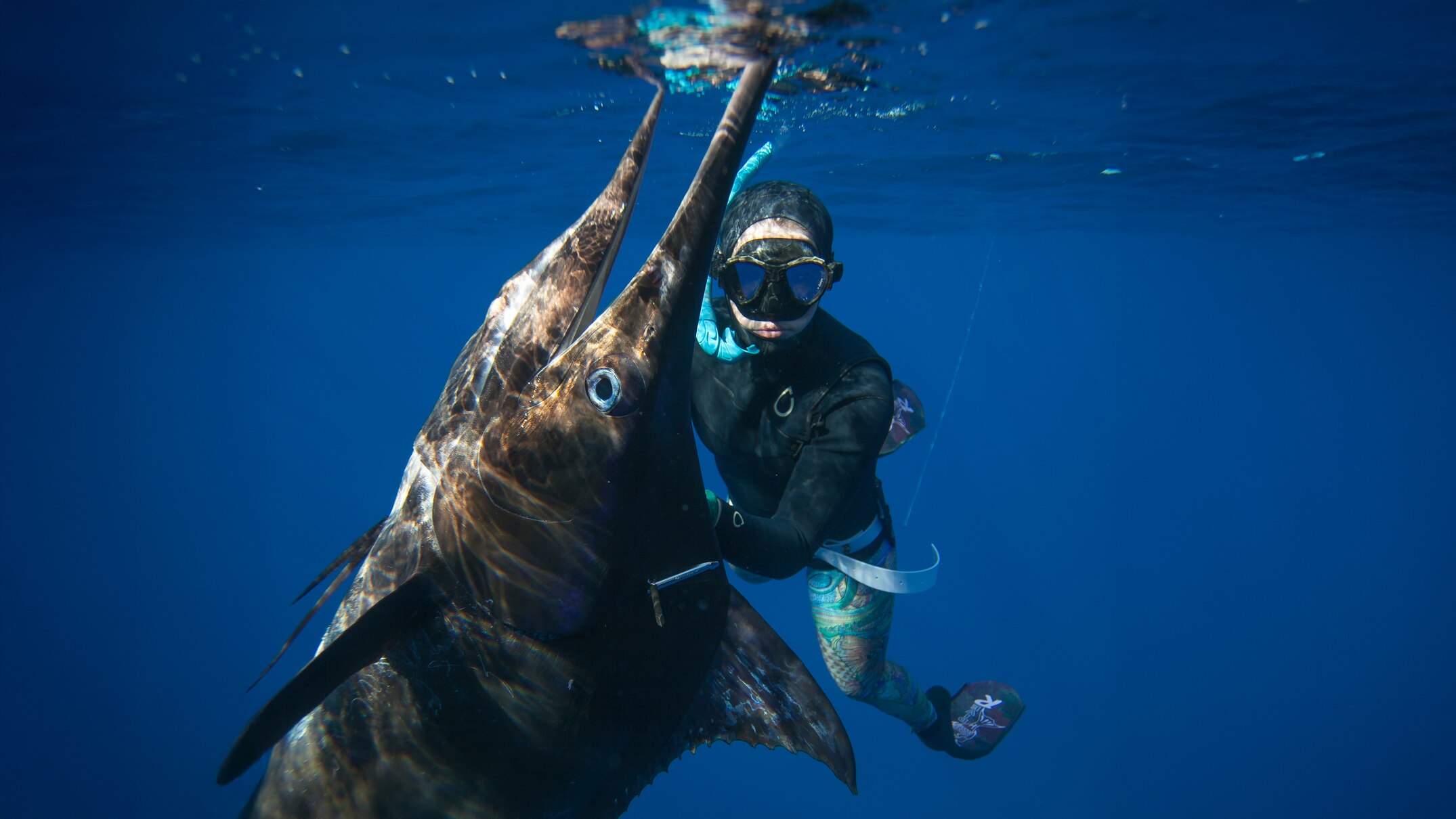 Australian woman claims marlin spearfishing record after breast cancer ...