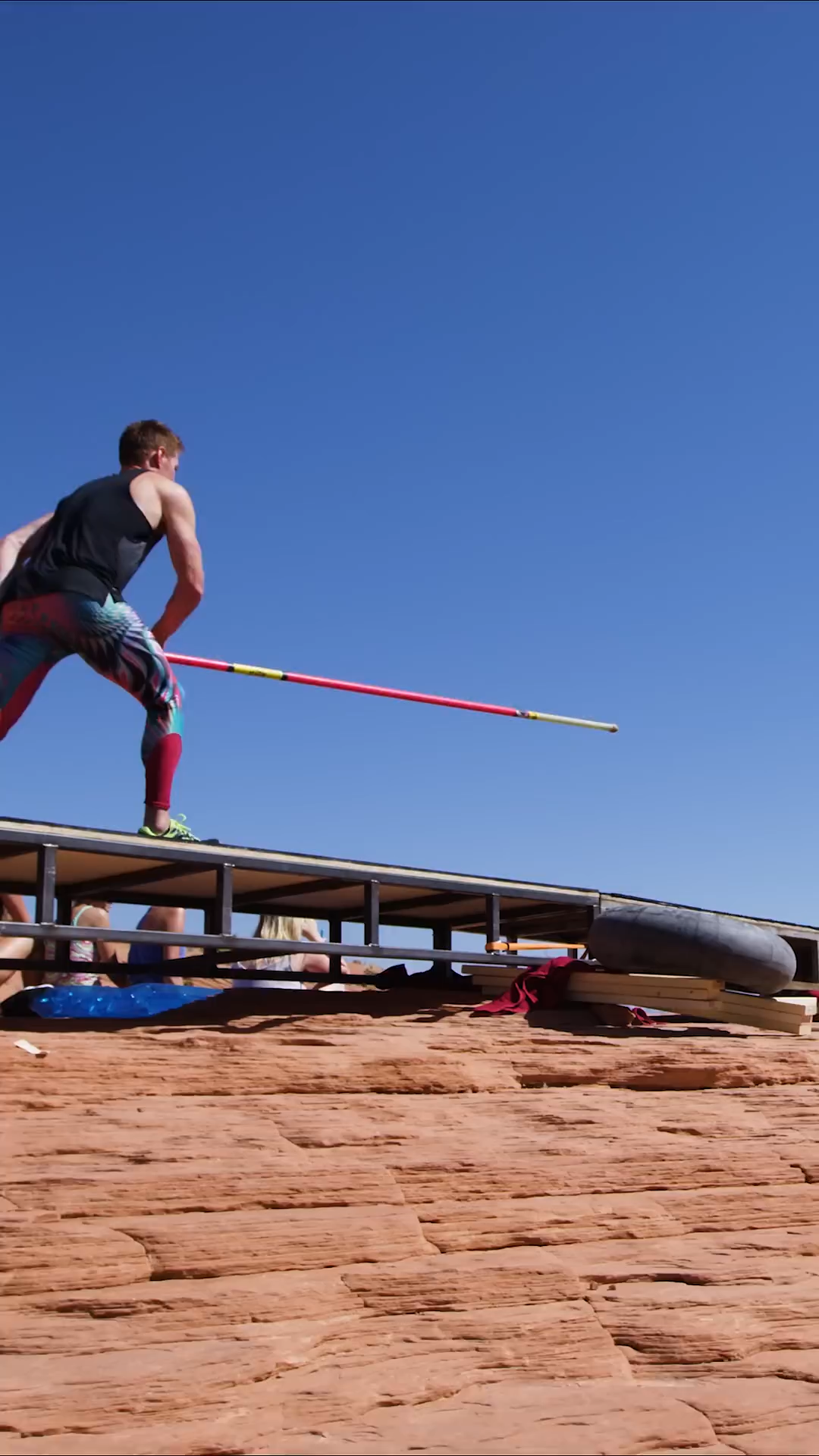 Catching a Football Pole Vaulting off Cliff