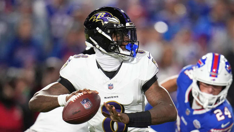 Lamar Jackson pushes Bills fan back into stands after helmet strike ...