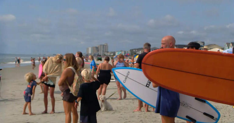 Surfers gather at Surfside Beach for competition, connections