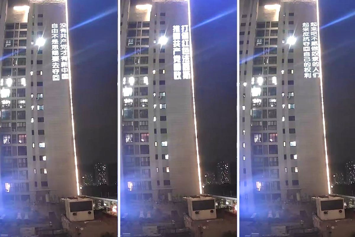 Qi Hong projiziert Protest an Hochhaus – und narrt Polizei