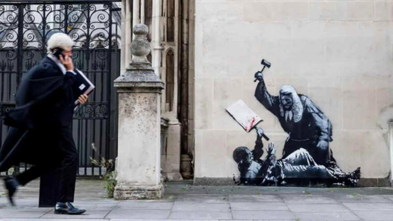 New Banksy on Royal Courts of Justice shows judge beating protestor