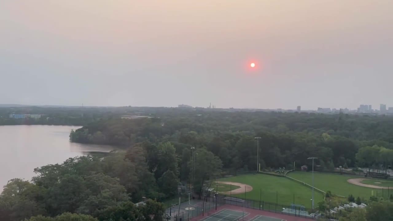 Sunrise through haze in Cambridge, Massachusetts, USA
