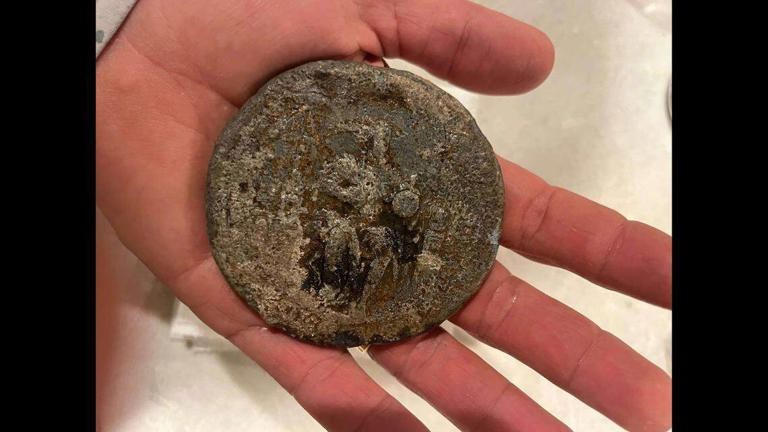 Odd disc found on Florida shipwreck tied to 1700s Spanish monarchy ...