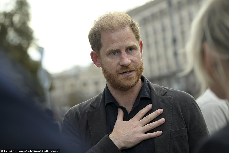 Prince Harry holds back tears while visiting memorial in Kyiv