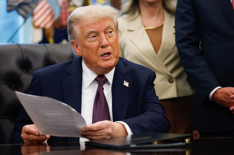 Trump's left hand 'glued over back of right' amid fears he's hiding injury