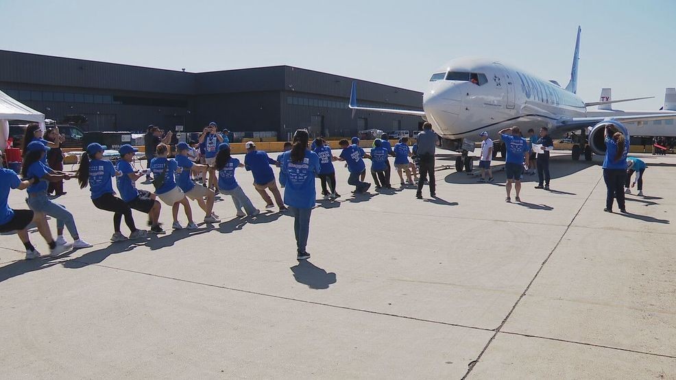 Teams pull 82-ton cargo plane at Dulles Airport to support Special ...