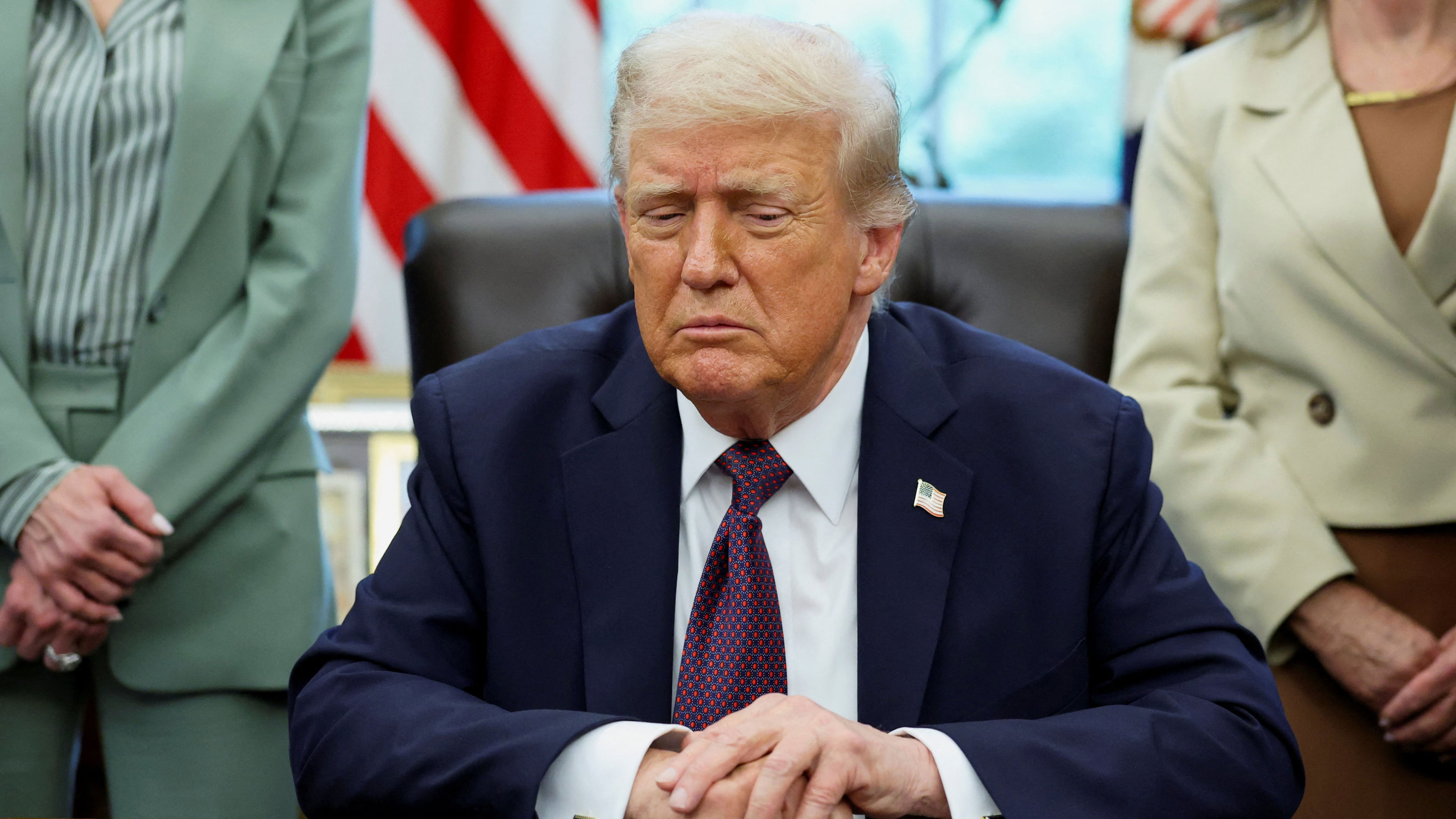 Trump, 79, Avoids Showing Makeup-Covered Hand in Oval Office