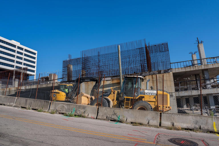 Construction begins on former Washington Square site as fines pile up