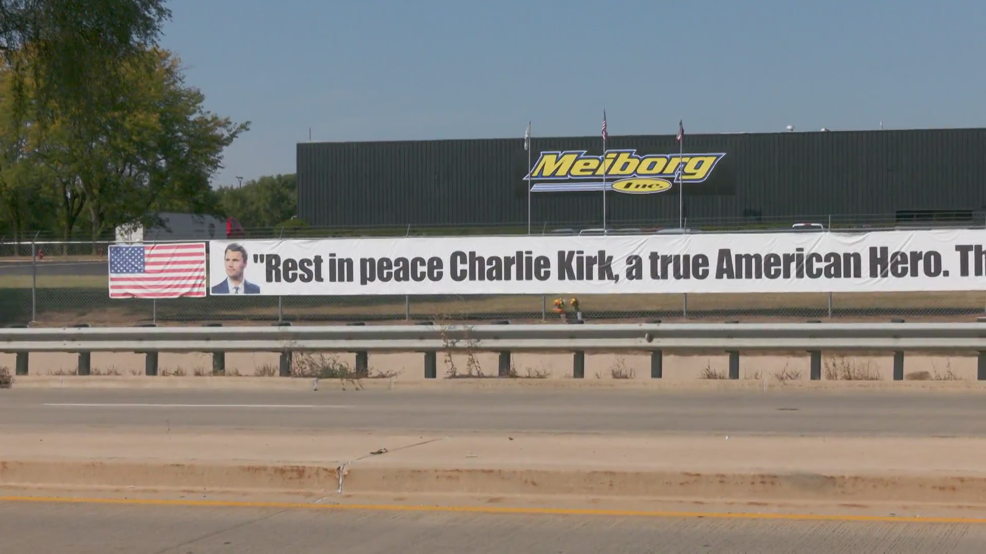 Rockford trucking company hangs large banner honoring Charlie Kirk